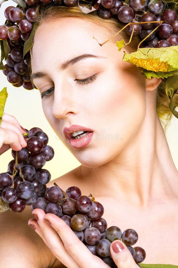 Young woman with grapes stock photo. Image of juicy, hand - 62545738