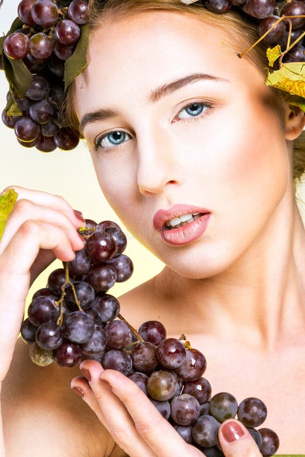 Young woman with grapes stock photo. Image of care, cheekbones - 62545742