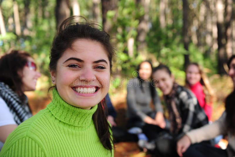 Young Woman with a Group of Friends Stock Photo - Image of female ...