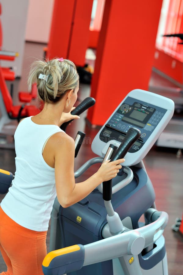 Young woman in the gym stock photo. Image of athletic - 10705018