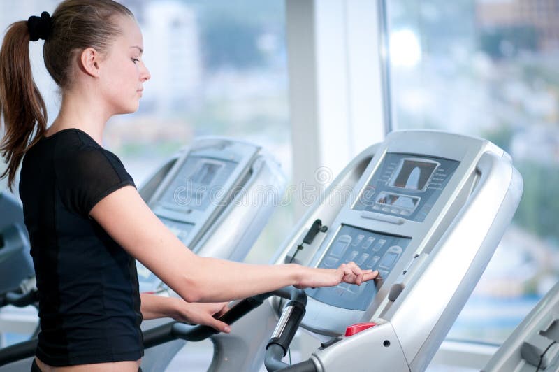 Young Woman at the Gym. Run on a Machine Stock Image - Image of ...
