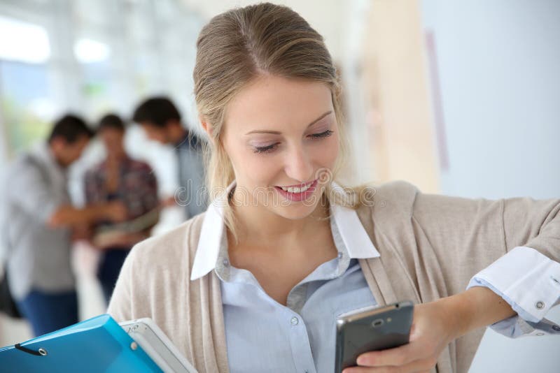 Young Woman in Hall Using Smartphone Stock Image - Image of business ...