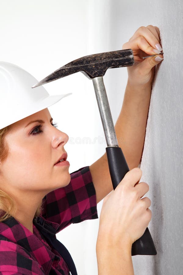 Young woman with a hammer stock photo. Image of blond - 39800366