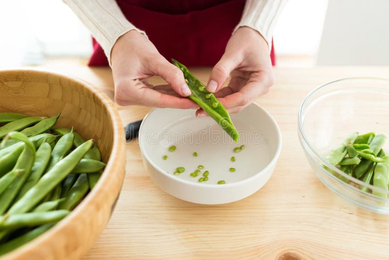 Young Woman Hands Hulled Green Beans from Shell in a Bowl at Home Stock ...
