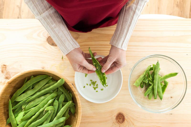 Young Woman Hands Hulled Green Beans from Shell in a Bowl at Home Stock ...