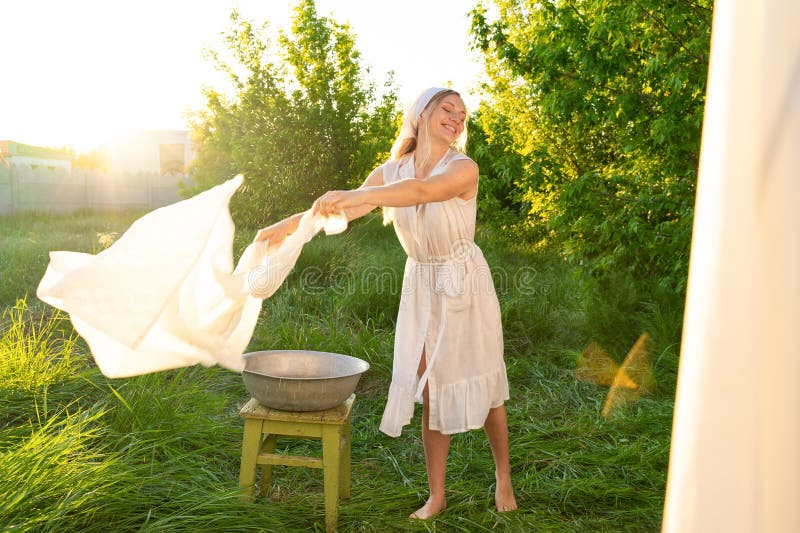Young Woman Hanging Laundry Outdoors Beautiful Girl Working In