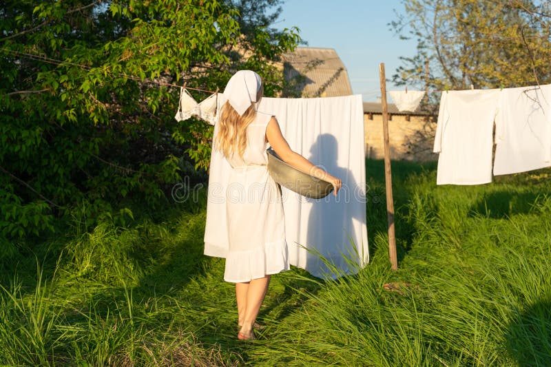 Young Woman Hanging Laundry Outdoors Beautiful Girl Working In