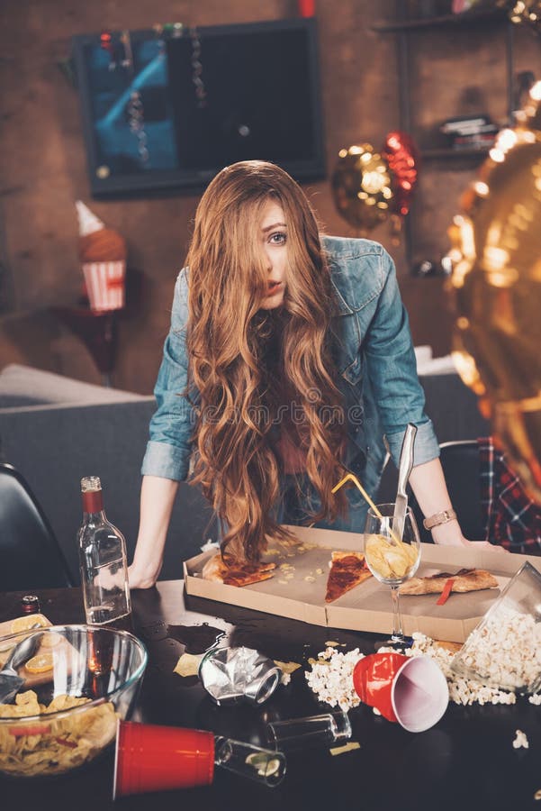 Young Woman with Hangover Leaning at Messy Table after Party Stock ...