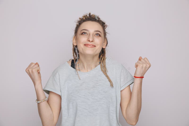 Young Woman is Happy and she is Showing Yes in a Grey Studio. Stock ...