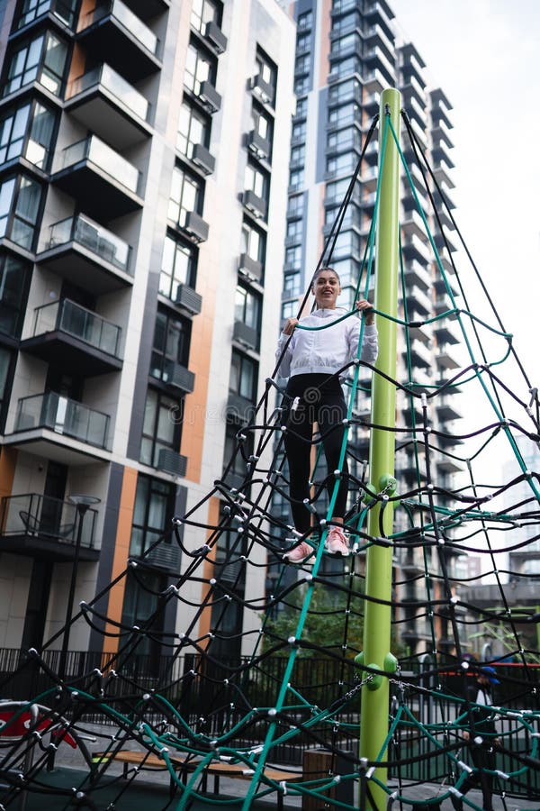 Young Woman Having Fun on the Rope Pyramid Stock Photo - Image of climb ...