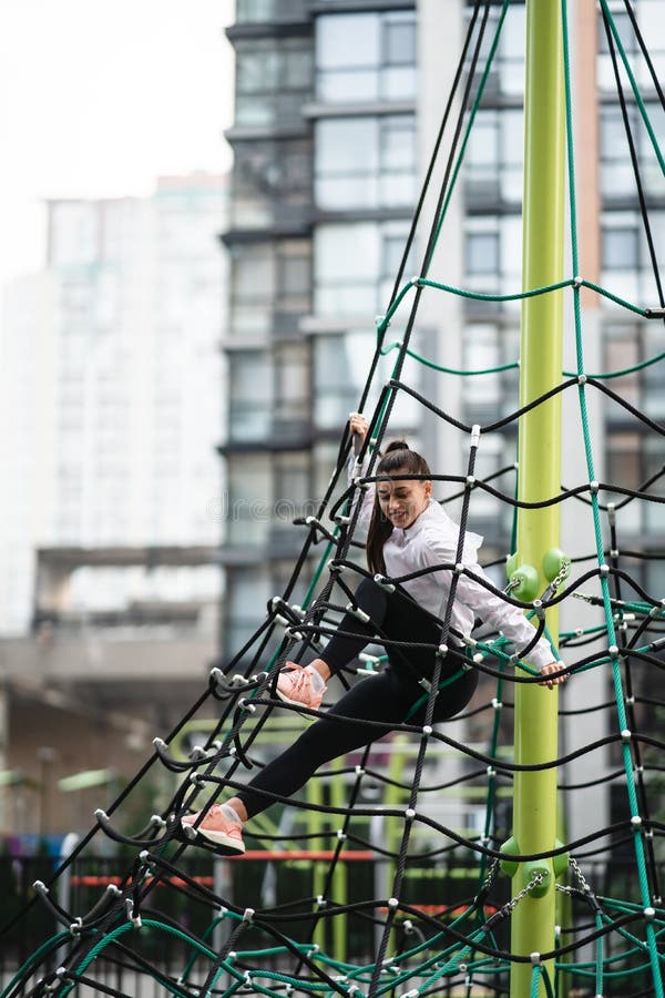 Young Woman Having Fun on the Rope Pyramid Stock Photo - Image of ...