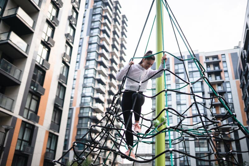 Young Woman Having Fun on the Rope Pyramid Stock Photo - Image of ...