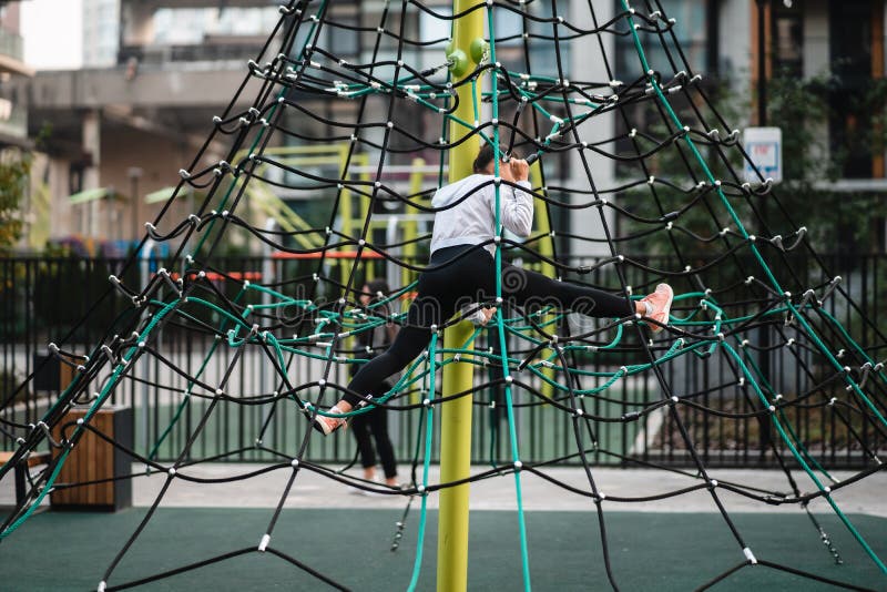 Young Woman Having Fun on the Rope Pyramid Stock Image - Image of ...