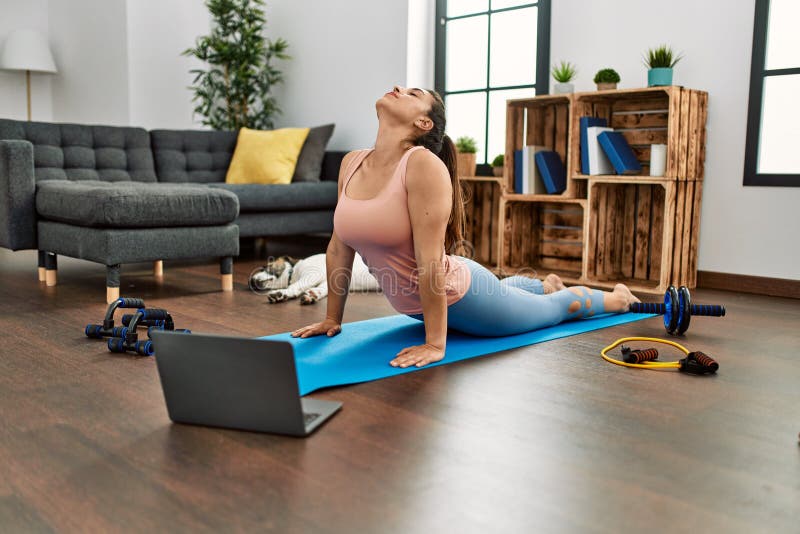 Young Woman Having Online Stretching Class at Home Stock Photo - Image ...