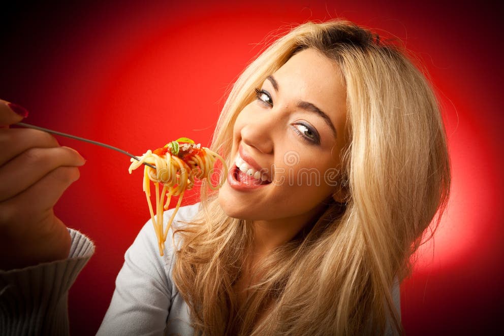 Young Woman Having Spaghetti Stock Photo - Image of taste, indoors ...