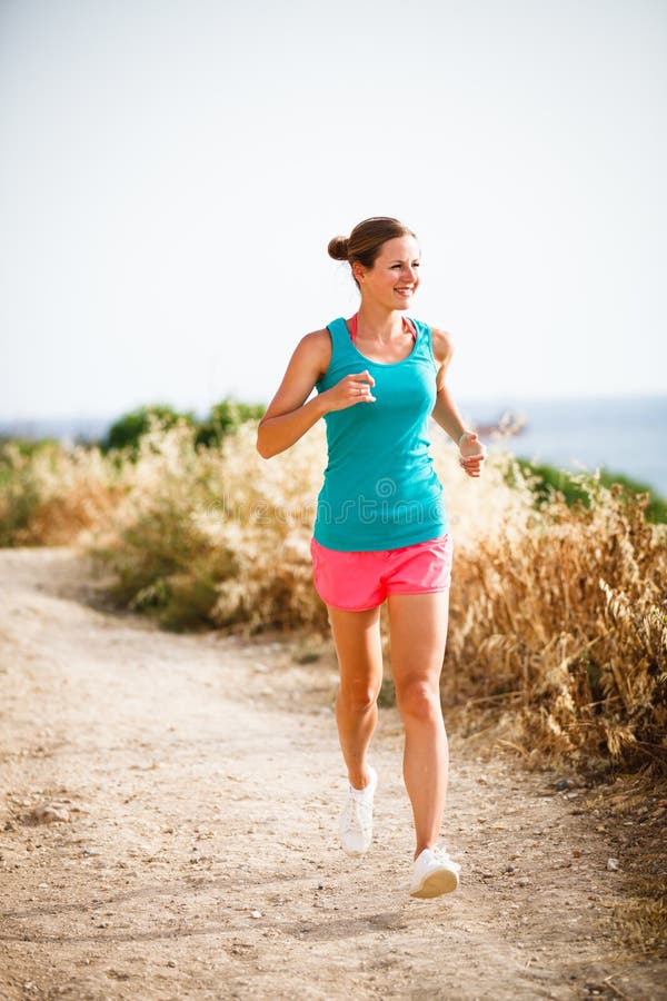 Young Woman on Her Evening Jog Stock Photo - Image of healthy, outdoors ...