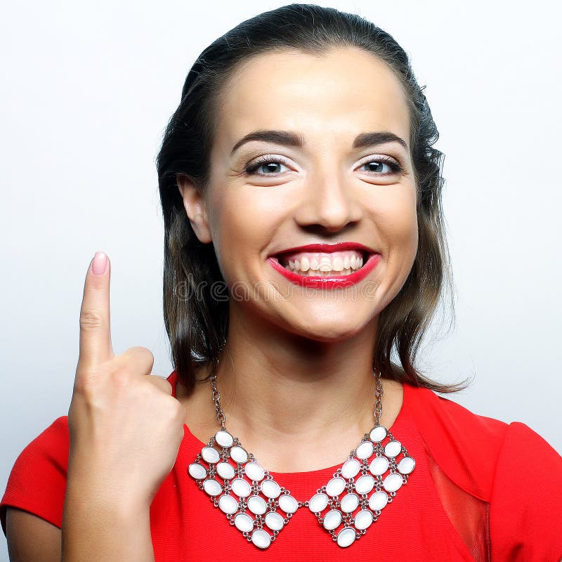 Young Woman with Her Finger Up. Good Idea! Stock Photo - Image of ...