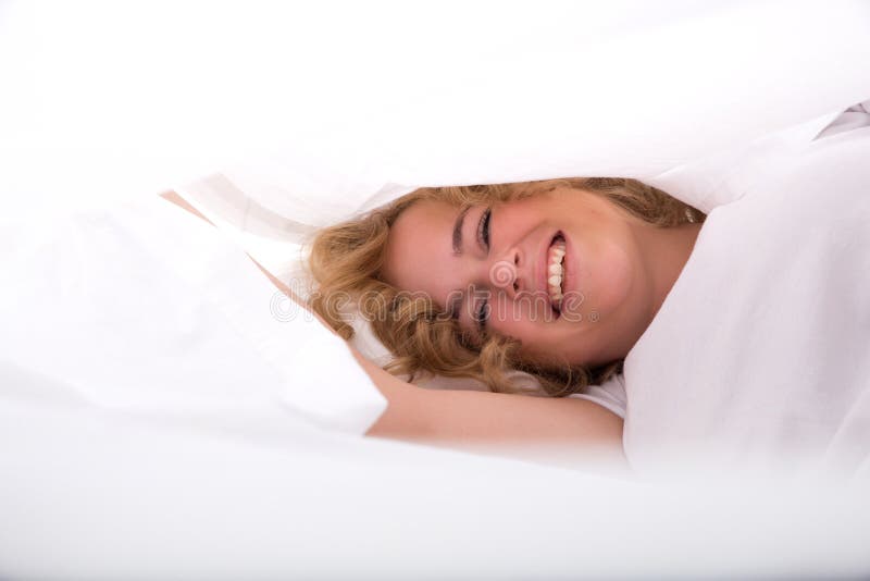 Young Woman Hiding in Bed Under the Sheets Stock Photo - Image of ...