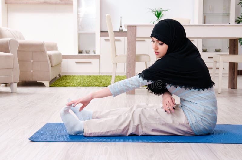 Young Woman in Hijab Doing Exercises at Home Stock Image - Image of ...