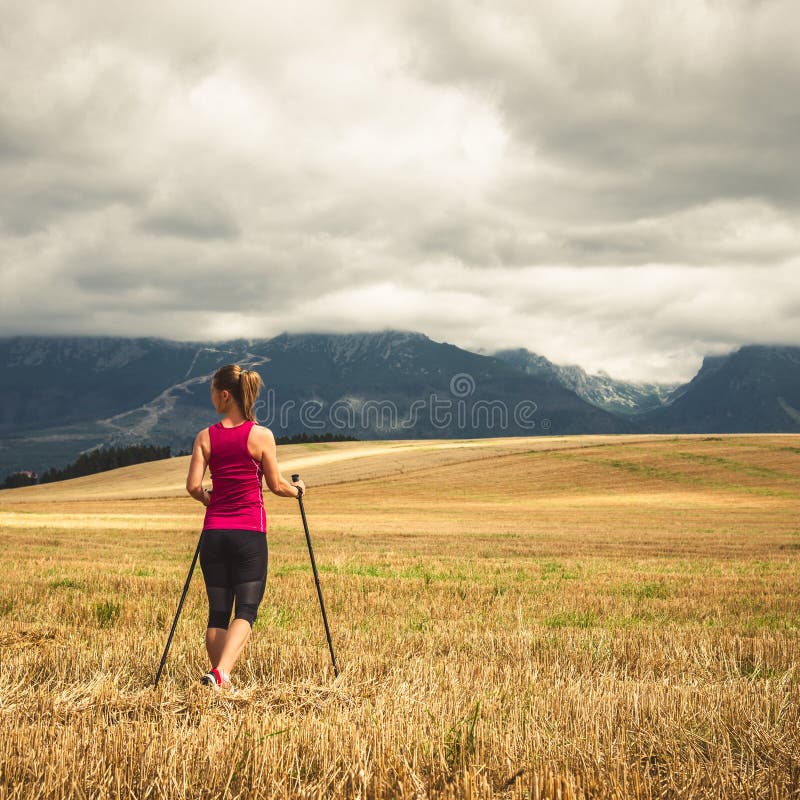 Young Woman Hiking in the Mountains Stock Image - Image of woman, young ...
