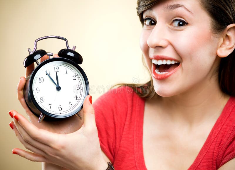 Young Woman Holding Alarm Clock Stock Image - Image of female, cheerful ...