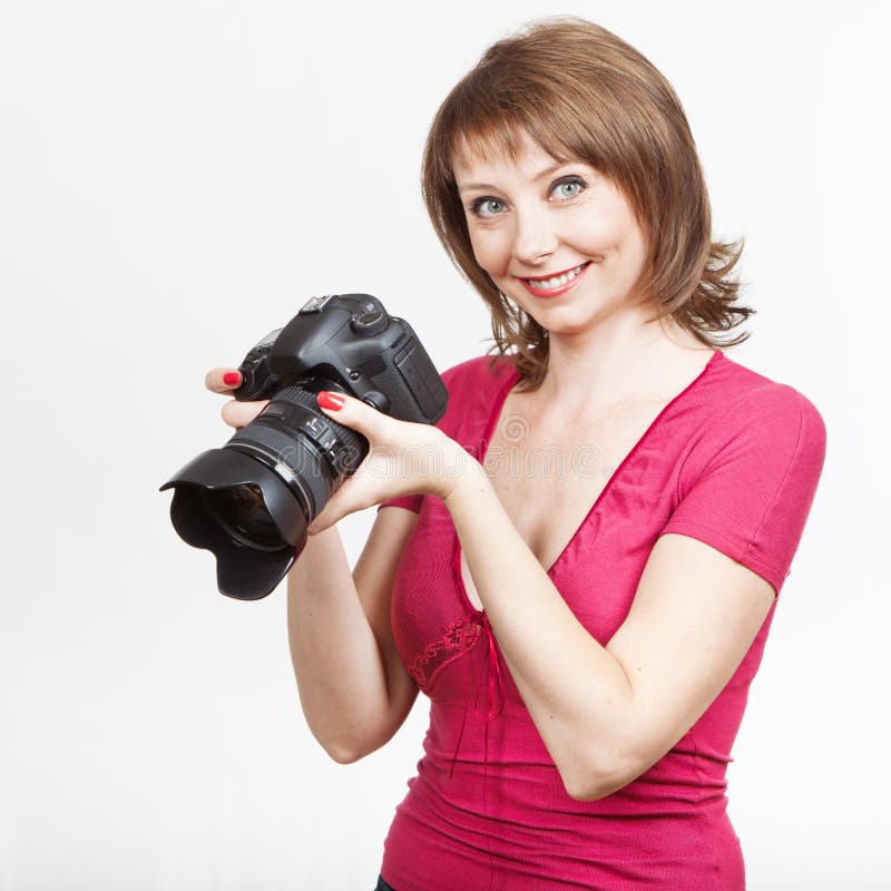 Young Woman Holding Camera and Looking Photos Stock Image - Image of ...
