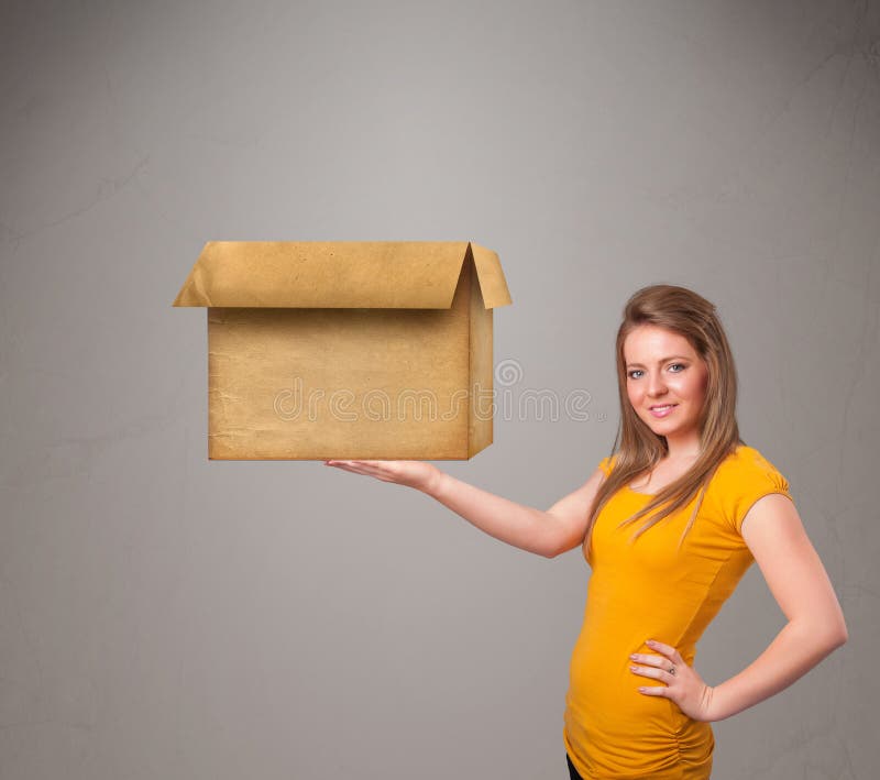 Young Woman Holding an Empty Cardboard Box Stock Photo - Image of ...