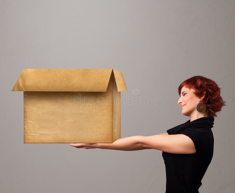 Young Woman Holding an Empty Cardboard Box Stock Photo - Image of ...