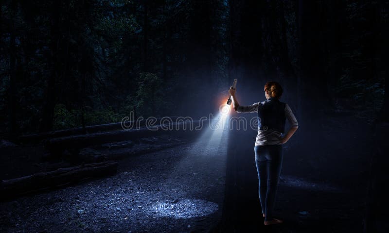 Young Woman Holding a Flashlight Stock Photo - Image of single, beam ...