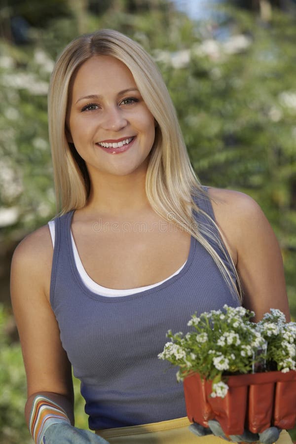 Young Woman Holding Flower Pot Stock Photo - Image of outdoors ...