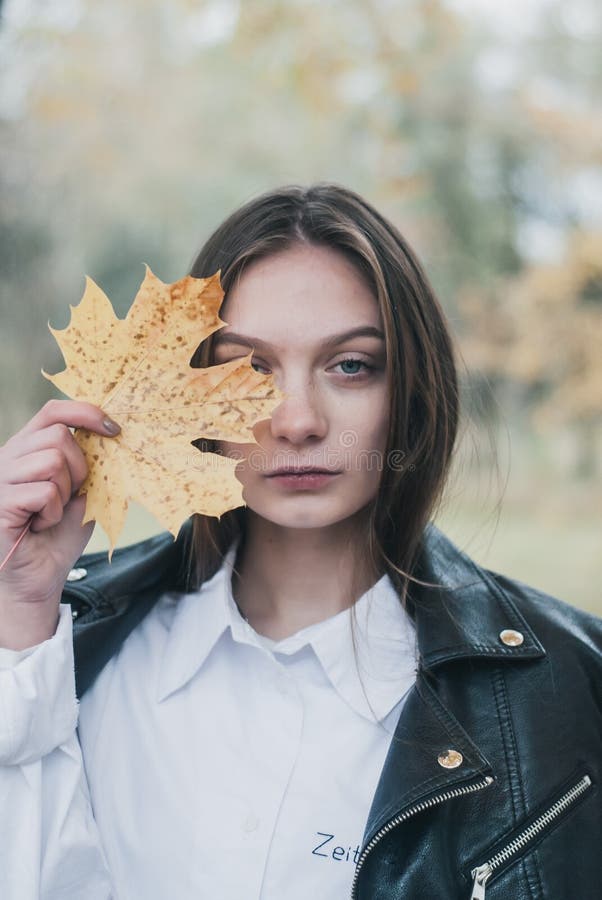 Young Woman Holding Gold Leaf Tree Outdoors in Forest Stock Image ...