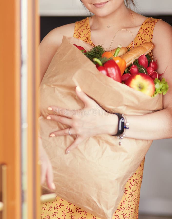 Young Woman Holding Grocery Shopping Bag with Vegetables Stock Photo ... Young Woman Holding Grocery Shopping Bag with Vegetables Stock Photo ...