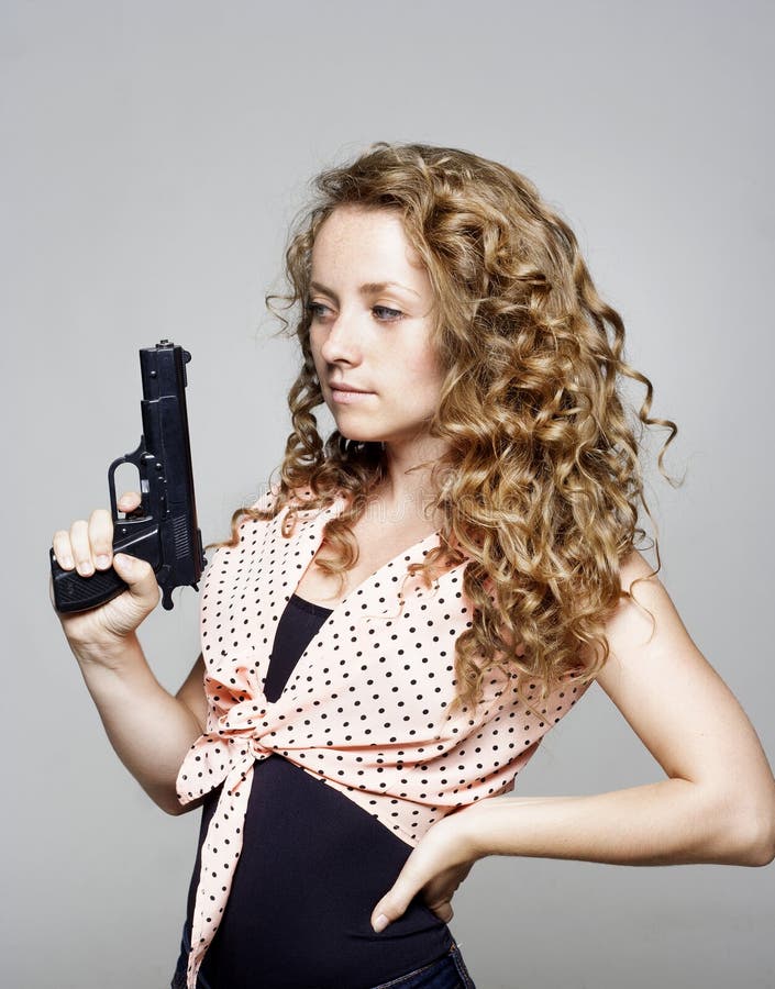 Beautiful Woman Holding a Gun Stock Image - Image of shoot, girl: 30067637
