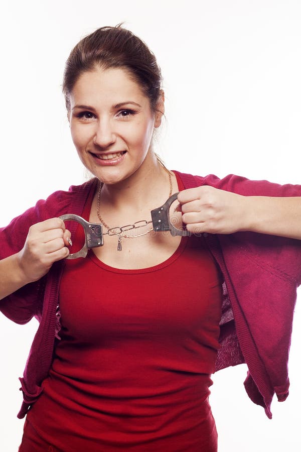 Young Woman Holding Handcuffs Stock Photo - Image of person, beauty ...