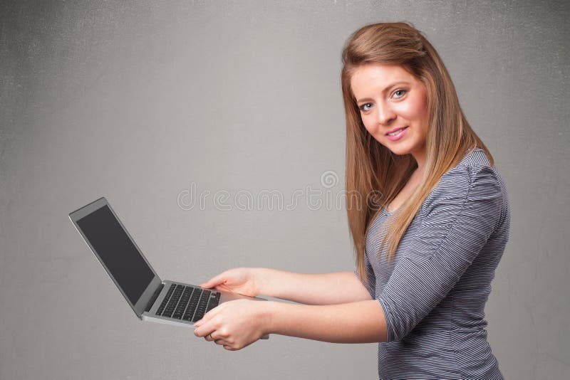 Young Woman Holding Modern Laptot Stock Photo - Image of gesturing ...
