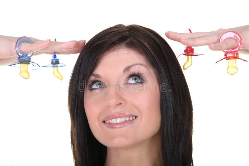 Young Woman Holding Pacifiers on White Background Stock Image - Image ...