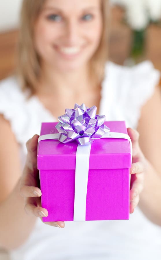 Young Woman Holding a Present Sitting on the Floor Stock Image - Image ...