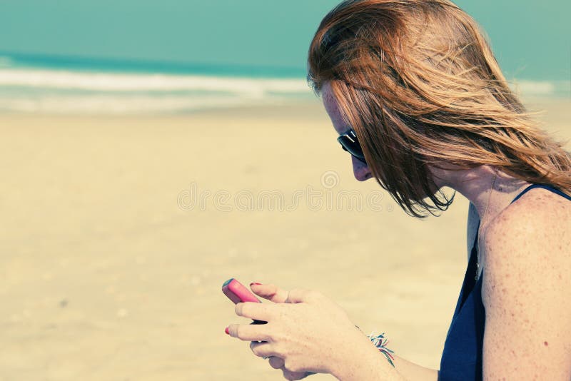 Young Woman Holding Smartphone Stock Photo - Image of girl, deck: 50855076