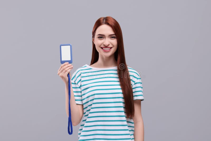 Young Woman Holding Vip Pass Badge on Grey Background Stock Photo ...