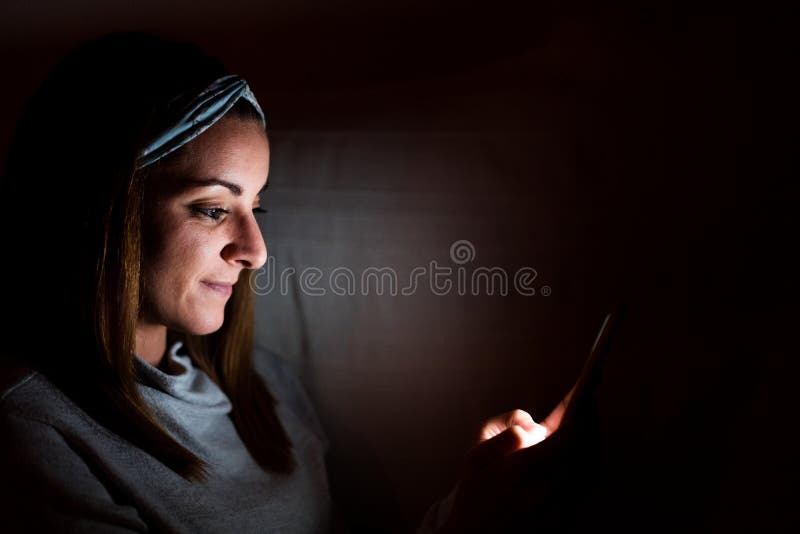 Young Woman at Home Using Mobile Phone. Night Time Stock Photo - Image ...