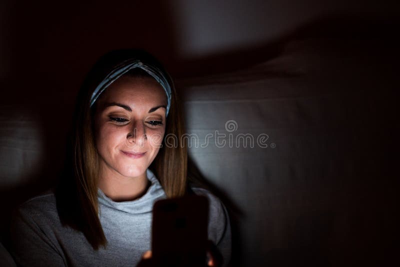 Young Woman at Home Using Mobile Phone. Night Time Stock Photo - Image ...