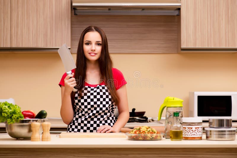 The Young Woman Housewife Working in the Kitchen Stock Photo - Image of ...