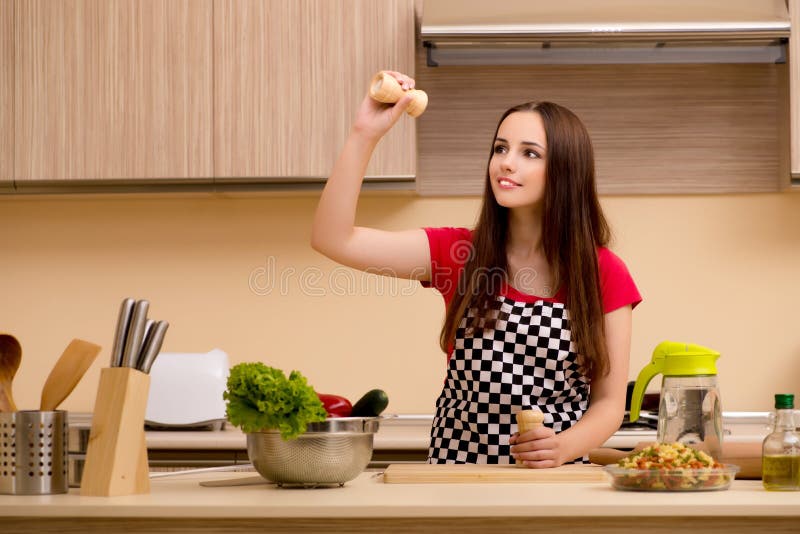 The Young Woman Housewife Working in the Kitchen Stock Image - Image of ...