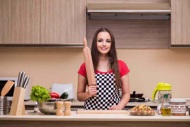 The Young Woman Housewife Working in the Kitchen Stock Image - Image of ...