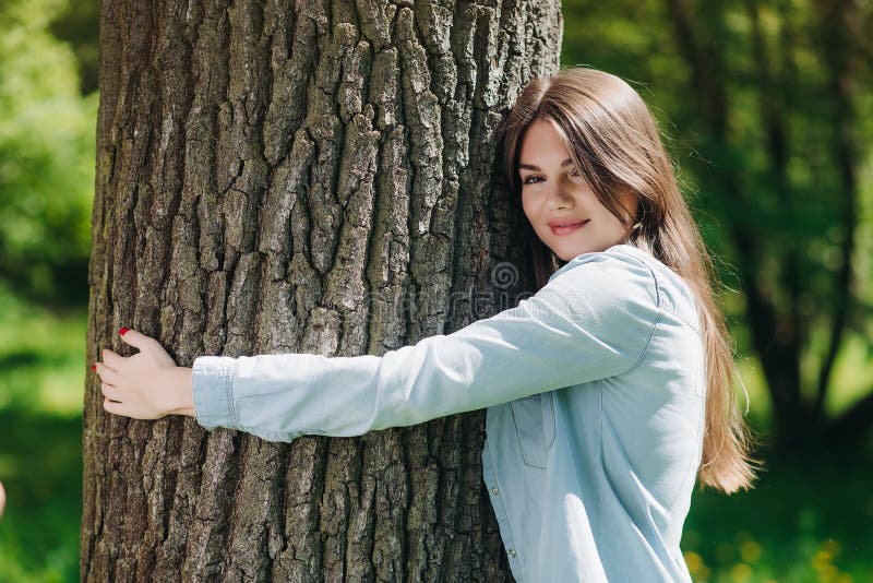 Woman hugging a big tree stock image. Image of female - 112402659