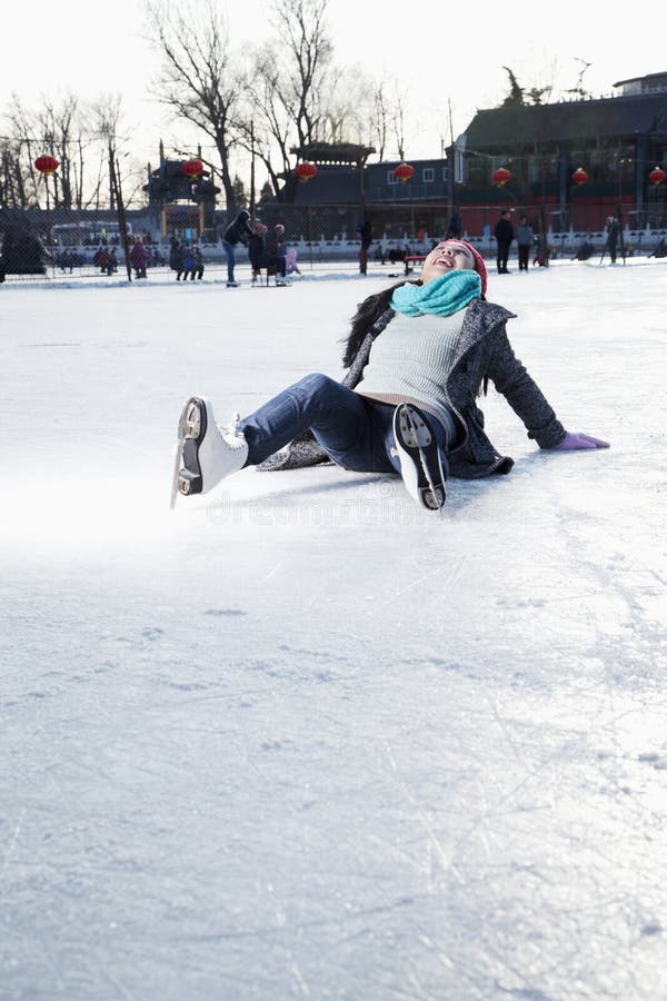Young Woman on Ice Rink, Lying on the Ice Stock Image - Image of ...