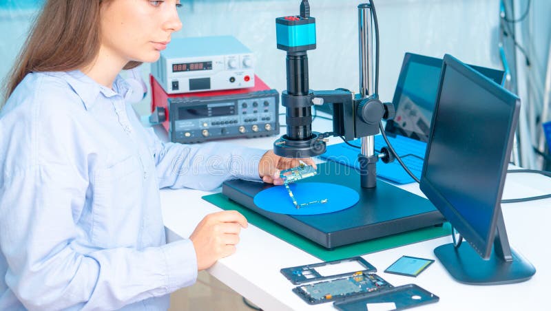 Young Woman in Inspection Electronics PCB Devise. Modern Electronics ...