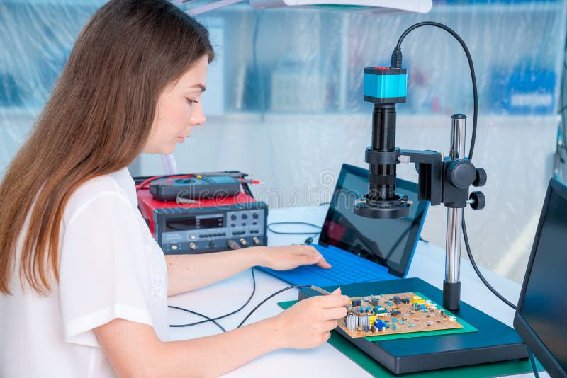 Young Woman in Inspection Electronics PCB Devise. Modern Electronics ...
