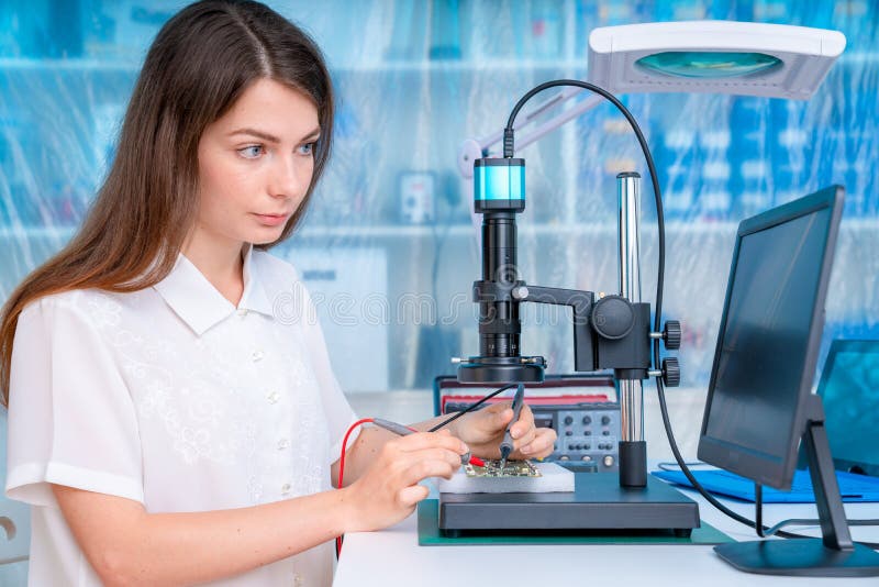 Young Woman in Inspection Electronics PCB Devise. Modern Electronics ...
