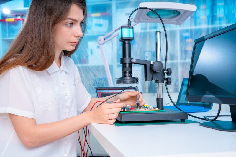 Young Woman in Inspection Electronics PCB Devise. Modern Electronics ...